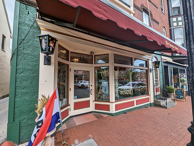 Step through these doors and leave the calendar behind&mdash;the Christmas Haus storefront beckons with warm light and holiday promise.