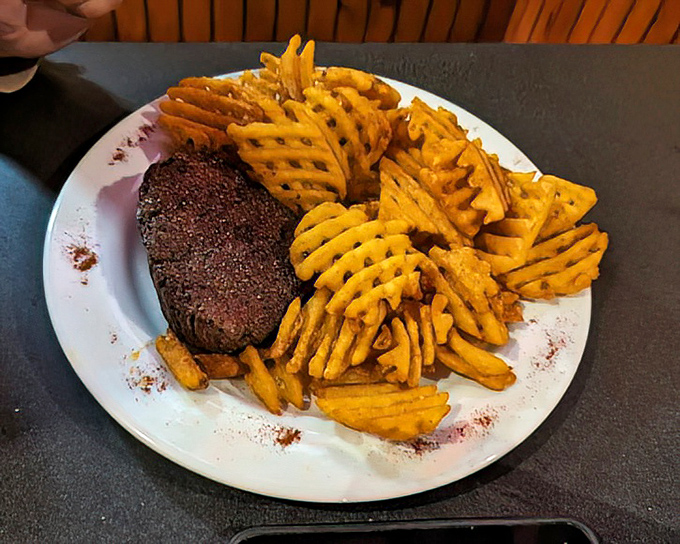 The star of the show: a perfectly seared filet mignon surrounded by golden waffle fries. Meat candy for grown-ups!