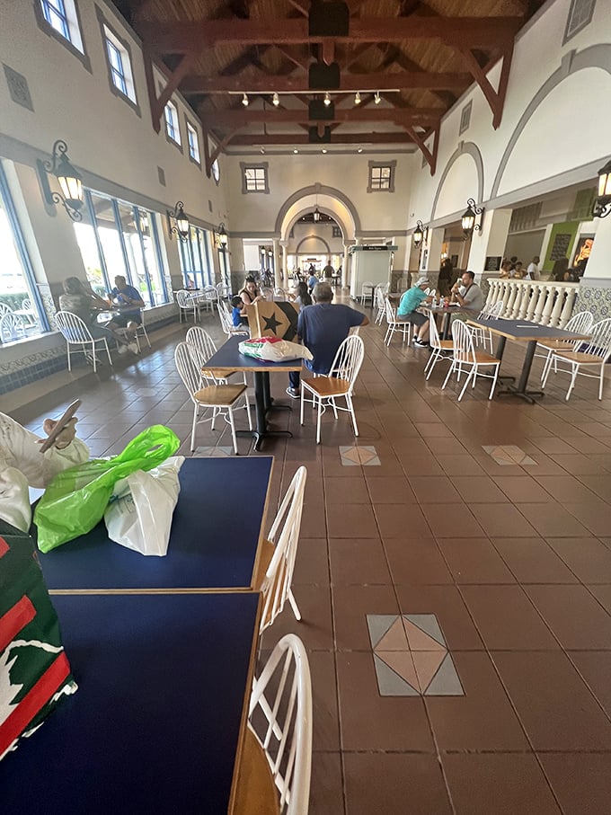 High ceilings, natural light, and comfortable seating transform a typical food court into a dignified dining experience between shopping sprints.
