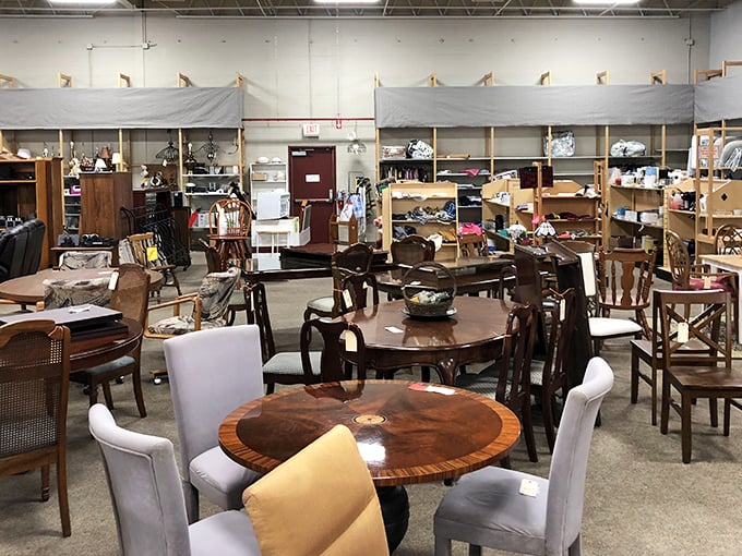 Dining tables that have hosted a thousand family dinners await their next chapter. Each wooden surface whispers stories of celebrations past.