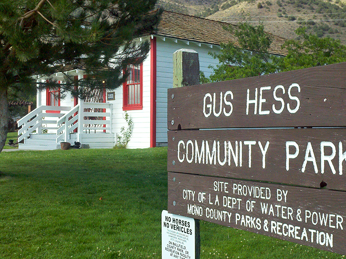 Gus Hess Community Park's charming blue schoolhouse looks like it was plucked straight from a Norman Rockwell painting, complete with mountain backdrop.