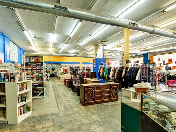 Exposed ductwork and concrete floors create an industrial-chic backdrop for racks of possibility. Marie Kondo would approve of this organized chaos.