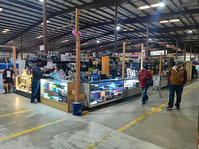 Vendor booths create a maze of possibility where shoppers navigate aisles of potential discoveries. The thrill of the hunt is palpable.
