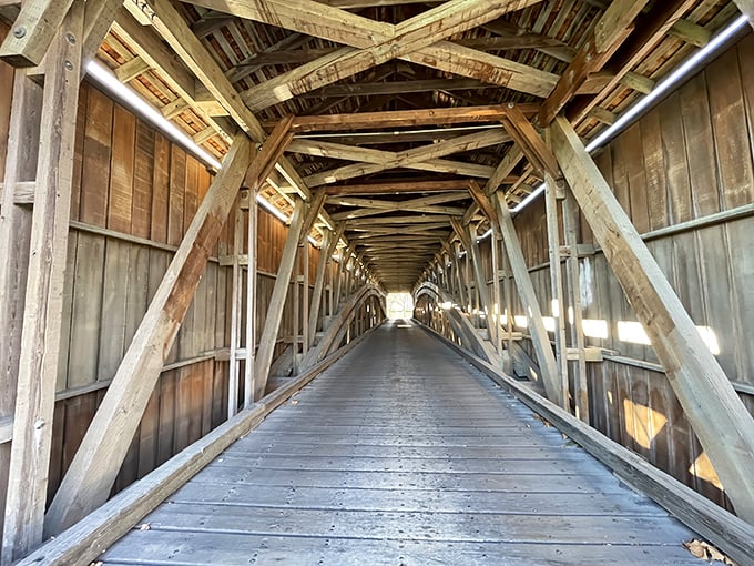 Step inside and witness American engineering poetry&mdash;hand-hewn beams creating a geometric dance overhead while sunlight plays hide-and-seek through the wooden slats.
