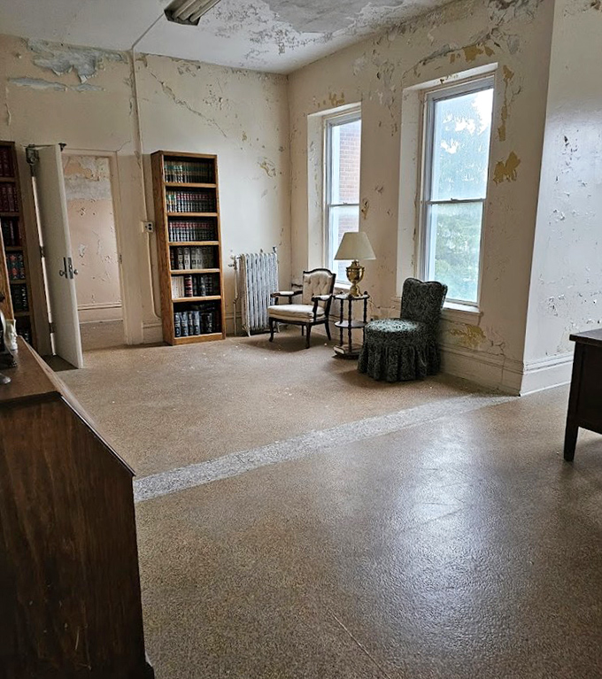 Time peels away at the walls like old secrets being revealed. The vintage furniture waits patiently, as if expecting long-gone residents to return.