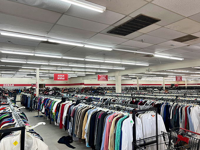 Endless rows of potential treasures await under fluorescent lights. It's like someone organized a clothing museum where you can actually take the exhibits home.