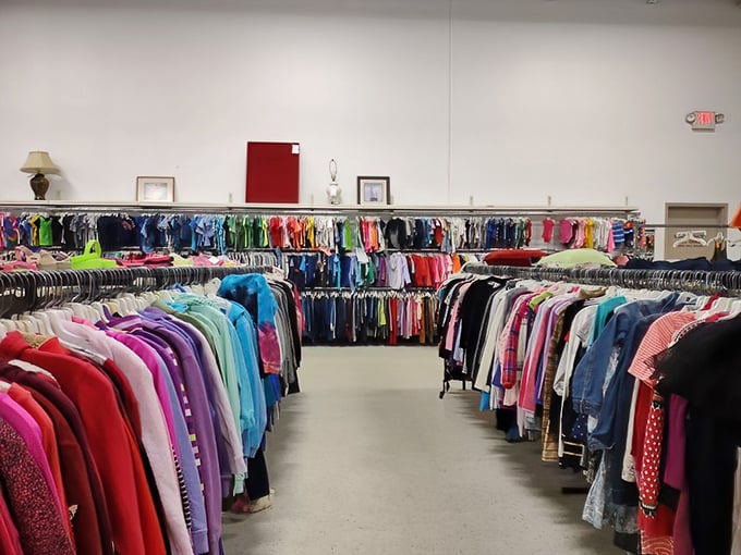 The rainbow effect of organized clothing creates an oddly satisfying visual feast. Each hanger holds someone's past and potentially your future statement piece.