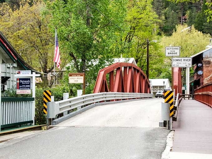 The iconic Jersey Bridge stands as Downieville's red-painted welcome committee, connecting not just two riverbanks but also the town's storied past with its adventure-seeking present.