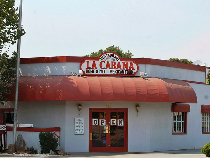 La Caba&ntilde;a's vibrant red awning isn't just a sunshade&mdash;it's a beacon calling to everyone whose soul needs authentic Mexican comfort food. 