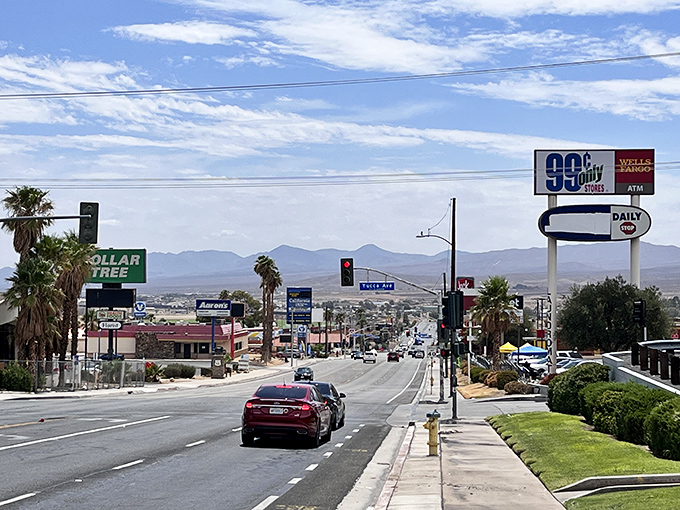 The commercial corridor stretches toward distant mountains, offering everyday necessities without the premium pricing of California's metropolitan areas.
