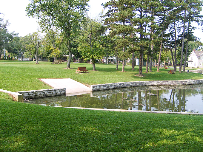 Lincoln Park offers a peaceful retreat where generations have gathered. The pond reflects not just clouds, but decades of community memories.
