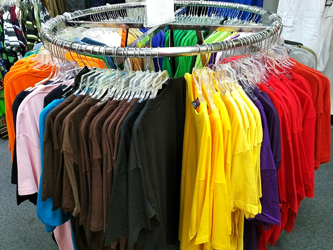The circular rack of t-shirts offers a color wheel of possibilities&mdash;like a fashion roulette where every spin wins you comfort at outlet prices.