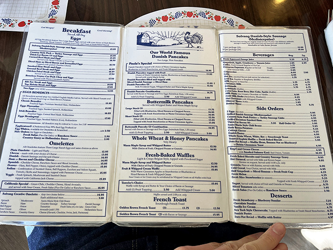 The menu reads like a breakfast lover's dream journal. That center column of Danish pancakes is where the magic happens.
