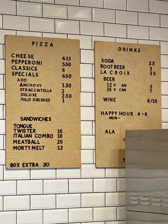 A menu that doesn't need a table of contents&mdash;just straightforward pizza perfection. Notice the "Morty Melt" sandwich? That alone deserves a pilgrimage. 