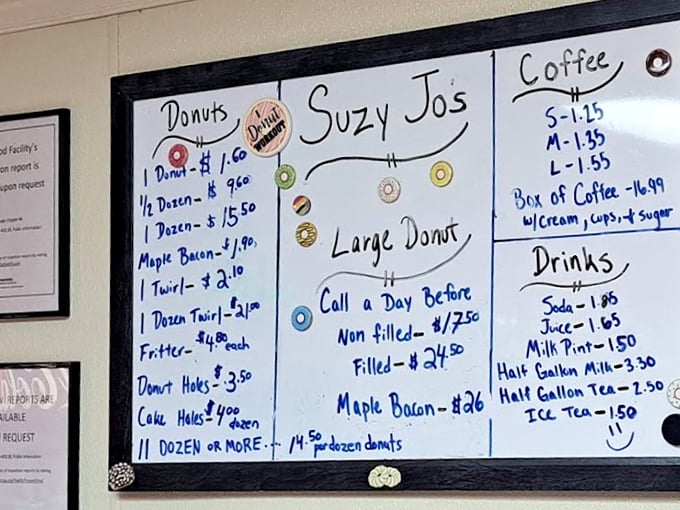 The handwritten menu board tells you everything you need to know&mdash;this place prioritizes donuts over design, substance over style.