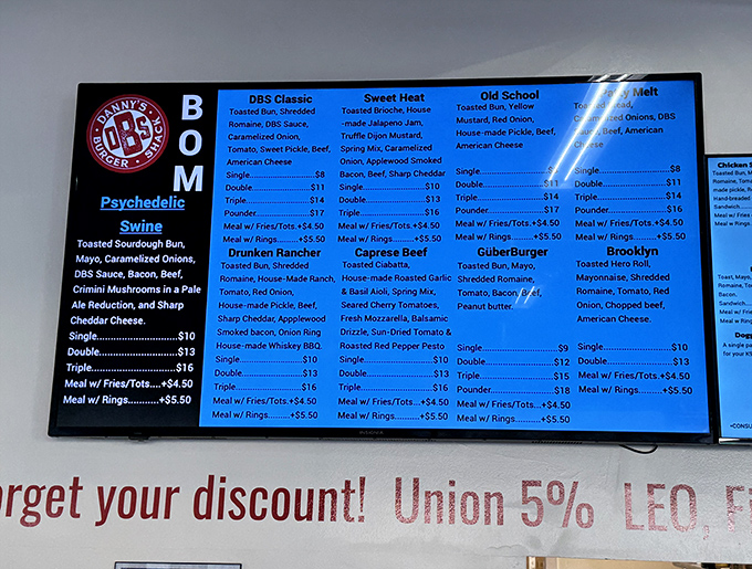 The menu board at Danny's reads like poetry for the hungry, with burger combinations that would make Shakespeare put down his quill and pick up a napkin.