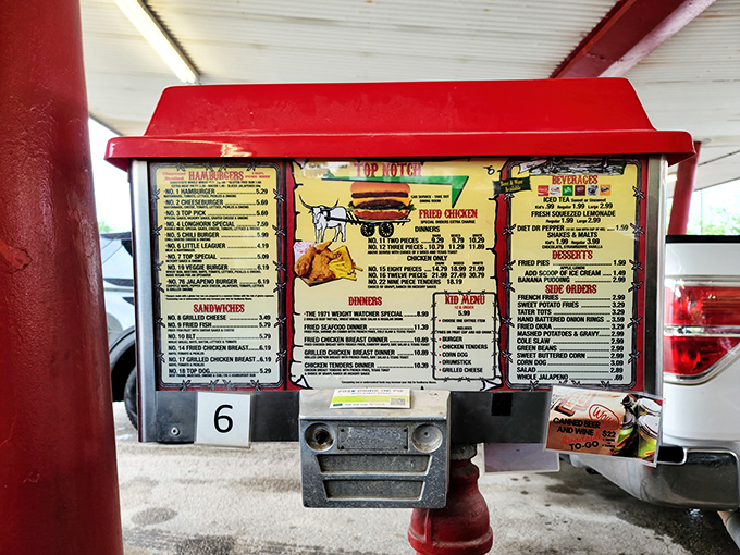 This menu board has witnessed more food decisions than a presidential dinner. The charcoal-grilled burgers remain the undisputed stars. 
