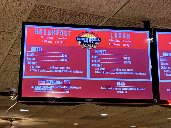 The digital menu board tells a simple truth: breakfast, lunch, and dinner await, with kids under 3 eating free&mdash;parents everywhere just perked up.