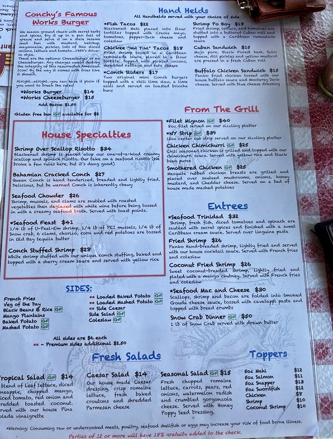 A menu that reads like a love letter to the sea. The hardest relationship you'll have today is choosing between the Conch Burger and Seafood Trinidad.