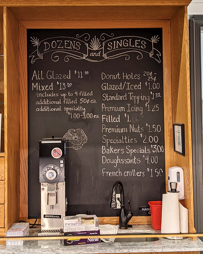 This chalkboard menu isn't just listing prices&mdash;it's offering a roadmap to happiness, one delicious donut decision at a time.