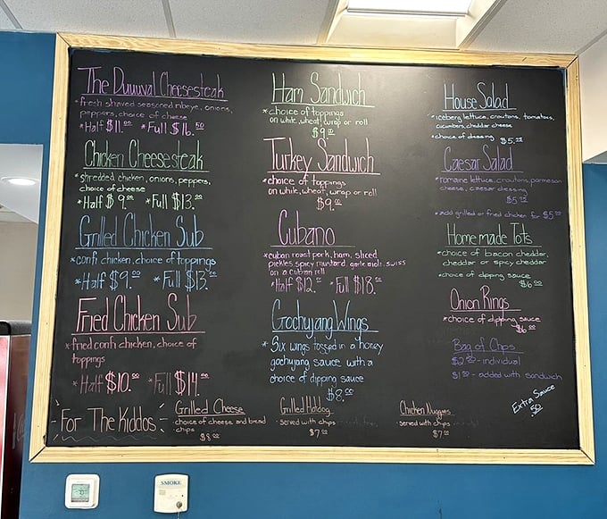 Chalkboard menus: where sandwich dreams are written before they're made. Each handwritten item promises a different path to satisfaction.