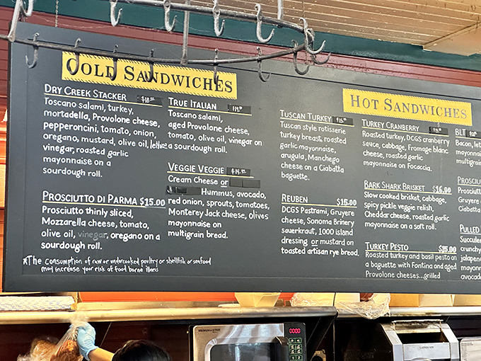 The chalkboard menu reads like poetry for the hungry cyclist. Each sandwich name promises a different journey through flavor country.