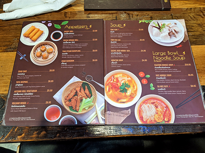 This isn't just a menu&mdash;it's a passport to flavor country. Each colorful page promises authentic Thai adventures that'll make your taste buds think they've booked a flight.