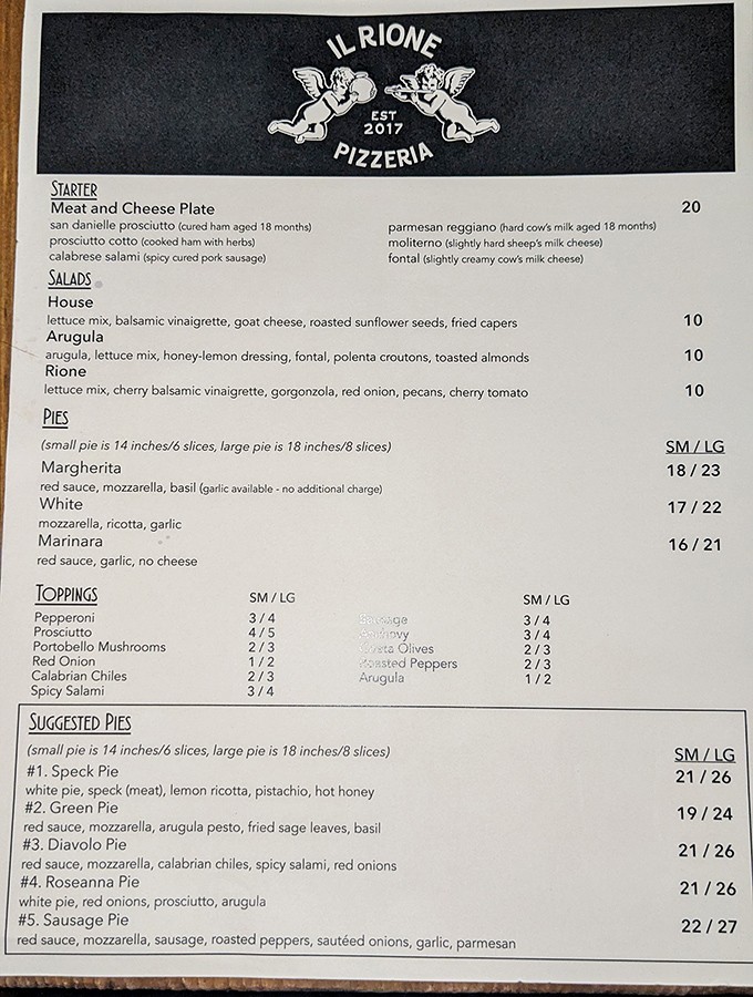 The menu board at The Crack Shack reads like poetry for poultry enthusiasts&mdash;each sandwich name more tempting than the last.