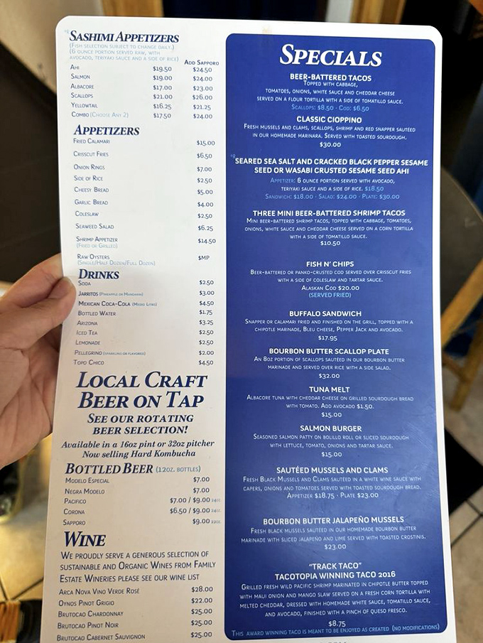 The menu reads like a love letter to the ocean. Each item promises a different maritime adventure, from sashimi appetizers to their legendary fish and chips.