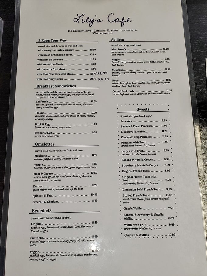 A menu that reads like a love letter to breakfast classics. That "ham off the bone" listing isn't just words&mdash;it's a promise of pork perfection.