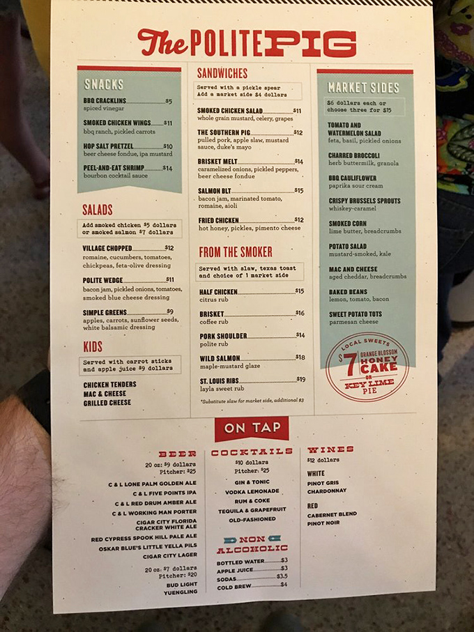 A menu that reads like barbecue poetry. Each description promises flavor combinations that would make a vegetarian reconsider their life choices.