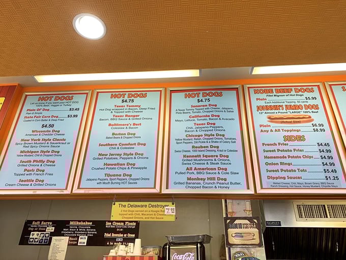 The menu board reads like a roadmap to happiness, with regional hot dog variations that could spark friendly debates among food purists.