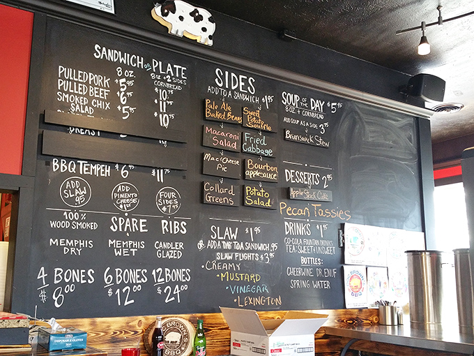 The chalkboard menu speaks the universal language of barbecue devotion&mdash;Memphis Dry, Memphis Wet, or Candler Glazed ribs? Life's most delicious dilemmas await.