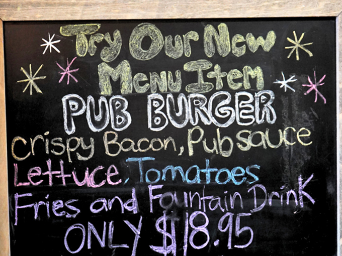 That chalkboard menu is like a love letter to comfort food, with the pub burger starring as the new kid on the block.