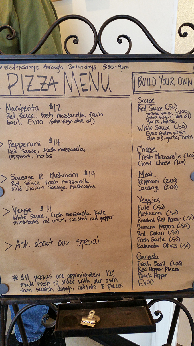 Handwritten menus are like love letters to food &ndash; this one promises pizza paradise at reasonable prices.