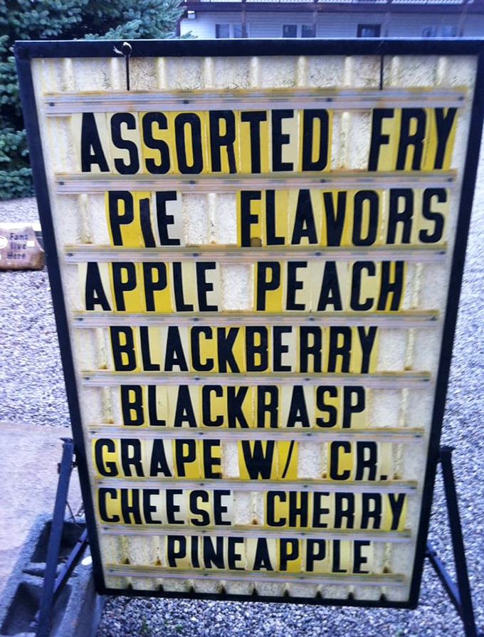 This sign isn't just a menu; it's a roadmap to happiness. The grape pie with cream cheese is the plot twist you never knew you needed.