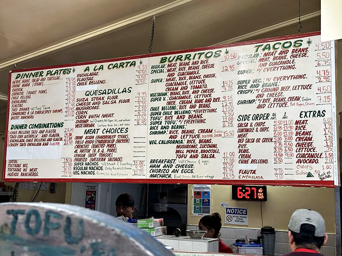 The wall of possibilities. Each handwritten menu item represents not just a meal, but a potential memory in the making.