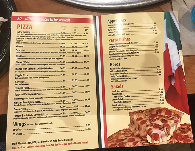 The menu reads like a love letter to pizza possibilities. Decision paralysis has never been so deliciously justified.