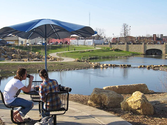 Riverside relaxation at its finest &ndash; where college students debate philosophy while ducks conduct their own important meetings.