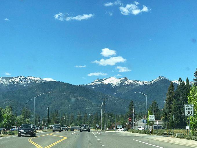 
Those mountains aren't just showing off&mdash;they're practically posing for your Instagram feed while you cruise through town at a civilized 30 mph. 