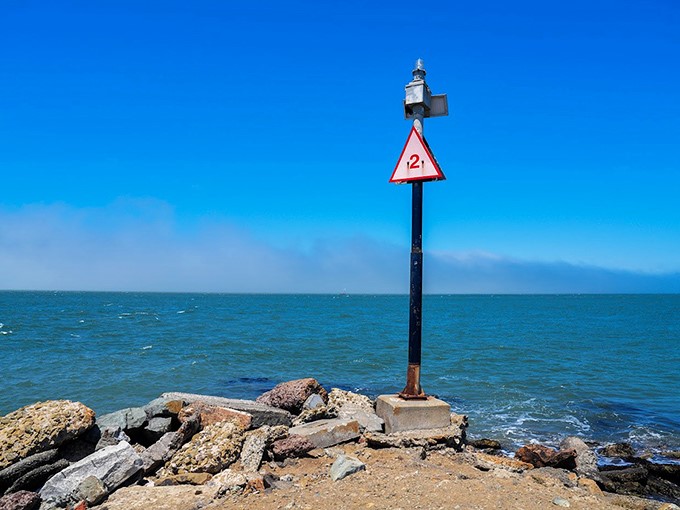 Even the navigational markers seem to stand at attention, as if listening to the bay's liquid symphony.