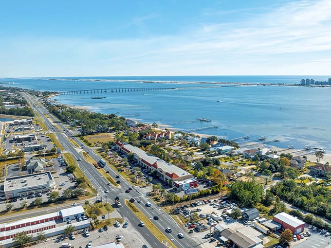The emerald waters of Santa Rosa Sound stretch toward Pensacola, with Navarre's low-rise development preserving those million-dollar views for everyone.