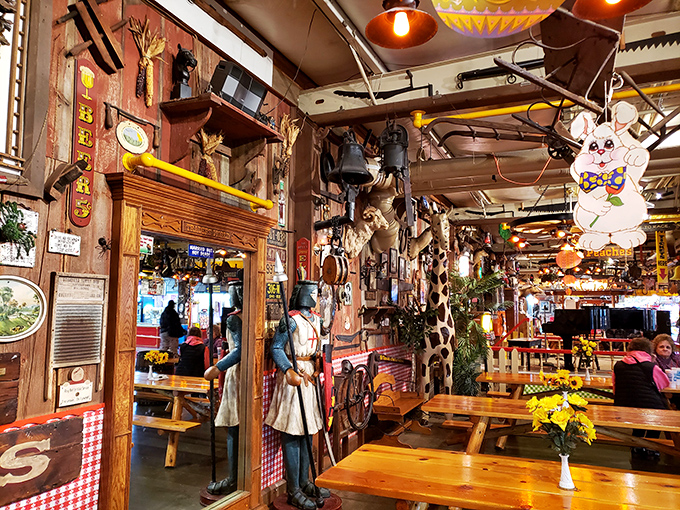 This rustic dining area feels like stepping into a time machine decorated by someone with a delightfully questionable attachment to taxidermy and nostalgia.