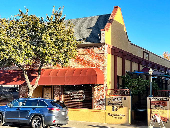 The Main restaurant's inviting brick exterior and cheerful yellow accents promise comfort food that satisfies both nostalgia and contemporary tastes.