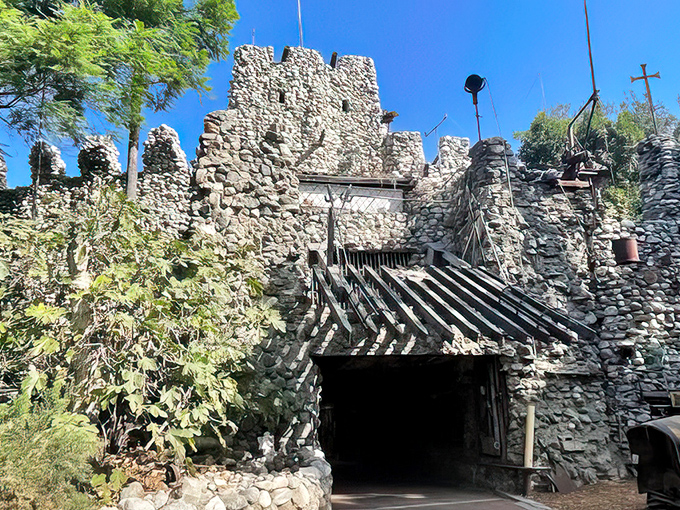 Medieval meets industrial in this stone fortress doorway. The wooden chevron entrance looks like it could withstand a siege&mdash;or at least a door-to-door salesman.