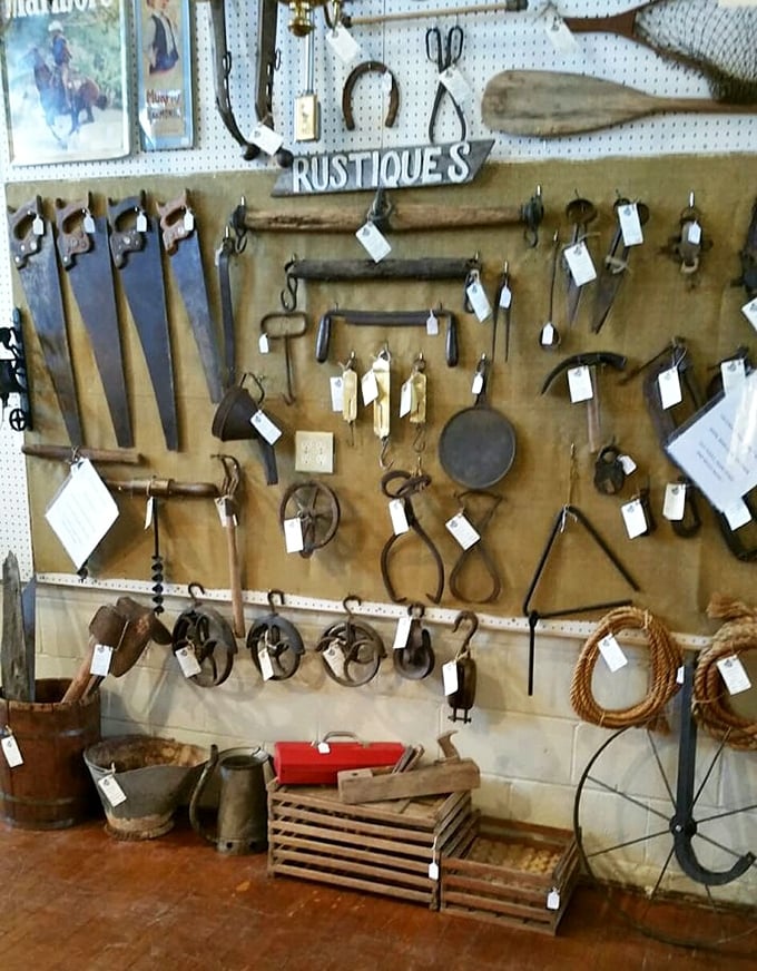 Tools with tales to tell. Each rusty implement on this "Rustiques" wall once shaped someone's livelihood before becoming wall art.