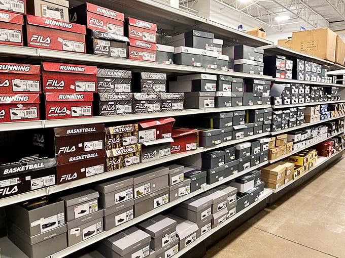 Shoe boxes tower like a sneakerhead's version of Jenga, each containing potential sole mates.