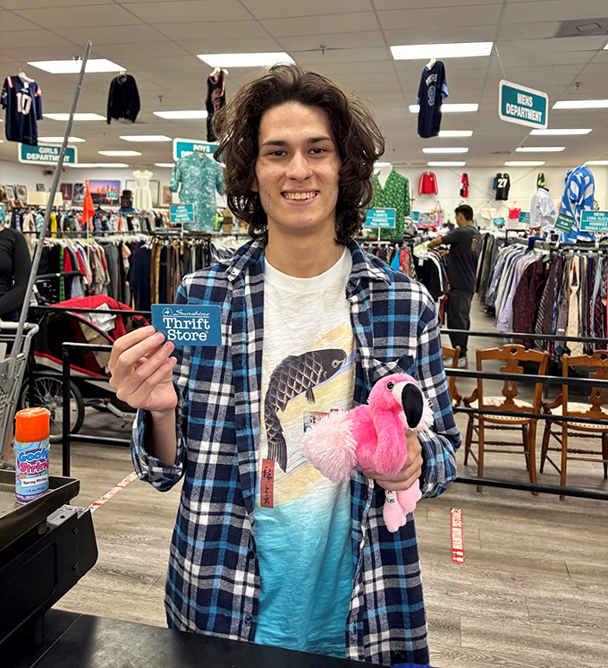 Victory looks like this: a flamingo plushie, a gift card, and the satisfied smile of someone who just scored big on a tiny budget.