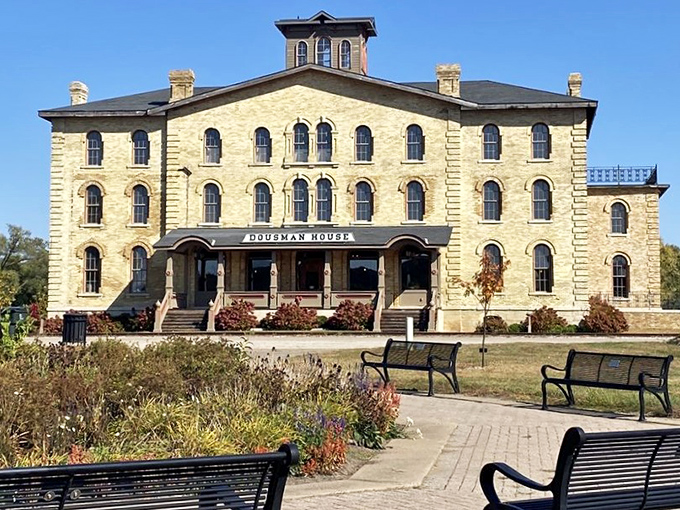 Dousman House stands as an elegant limestone testament to Victorian opulence, where river barons once surveyed their Mississippi kingdom.