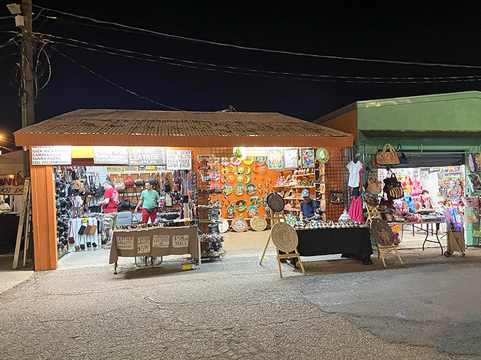 As night falls, the stalls light up like a miniature city of possibilities. Each booth holds someone's livelihood and someone else's next great find.